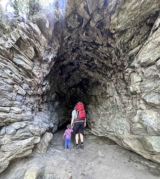 The cave entrance towers overhead, making even grown-ups feel wonderfully small in the best possible way.