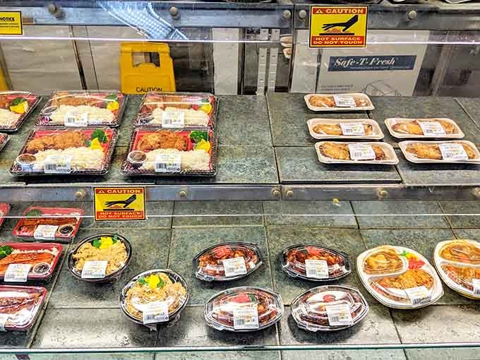 Bento boxes lined up like edible works of art, each one a complete meal waiting to happen.
