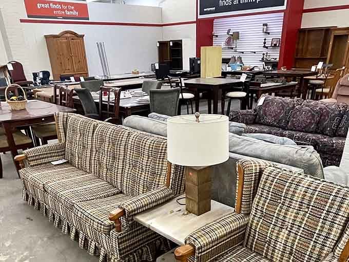 From plaid couches to elegant dining sets, this furniture section looks like a showroom, not a thrift store.