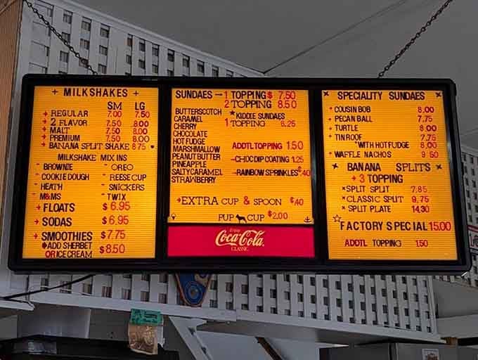 This glowing menu board promises everything from simple scoops to elaborate sundaes that require architectural planning.