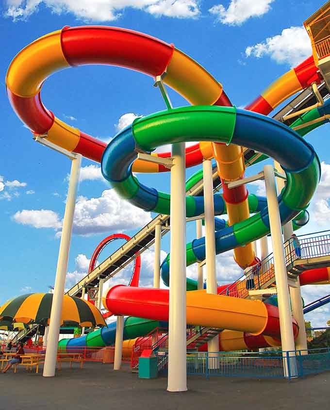 Those rainbow water slides twist skyward like a celebration of summer frozen in colorful loops.
