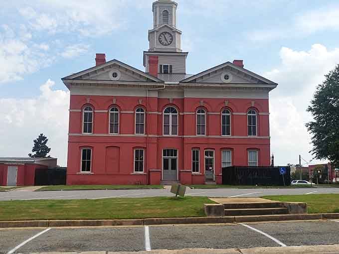 The Johnson County Courthouse commands attention like Atticus Finch's office, all red brick dignity and timeless Southern grace.