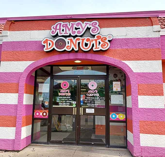 Those pink and orange stripes are louder than a disco ball, and the donuts inside match that joyful energy perfectly.