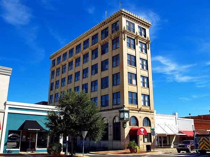 That vintage building stands tall against blue skies, a testament to when architecture had personality and staying power.