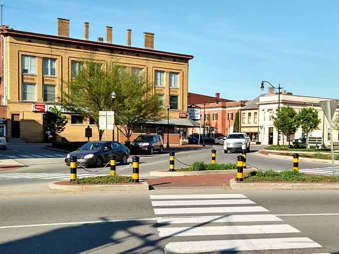 The town square radiates old-world sophistication with its manicured landscaping and stately brick facades all around.