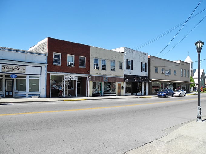 Sunshine bathes these simple storefronts in golden light, proving beauty doesn't need to shout to make an impression.