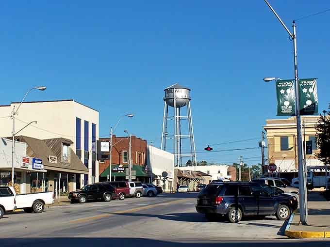 The water tower stands sentinel over town, a classic landmark visible for miles that says "you're home" to residents.