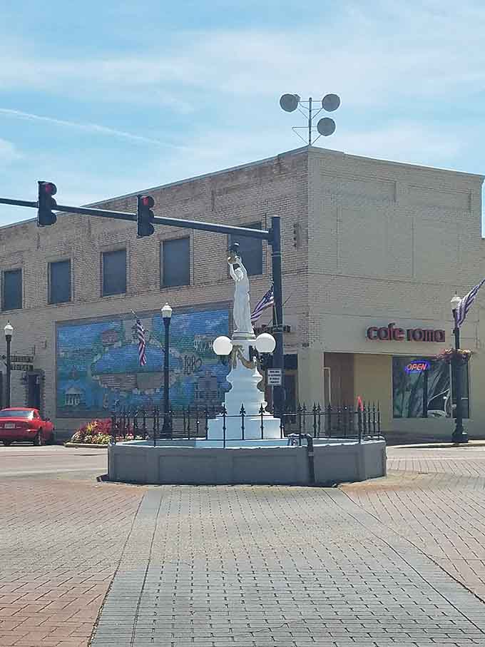 A classical statue holding a bug aloft in downtown&mdash;only in Alabama would this make perfect sense.