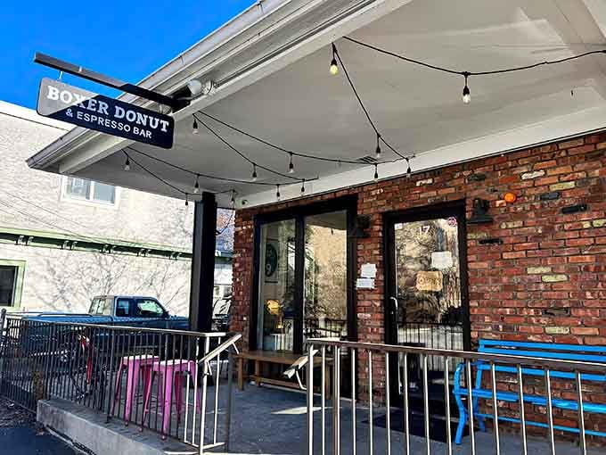 Brick walls and string lights create the perfect patio spot for savoring handcrafted donuts and espresso.