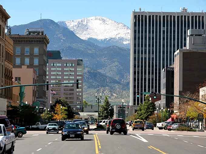Pikes Peak rises beyond downtown streets like nature's own skyscraper, making every commute a scenic wonder.