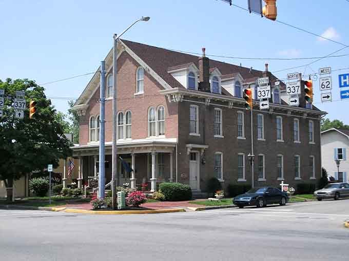 This stately brick beauty sits at the crossroads like it's been directing traffic since horse-and-buggy days.