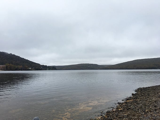 Even on overcast days, this mountain lake reflects the sky like polished silver, creating a peaceful mirror world.