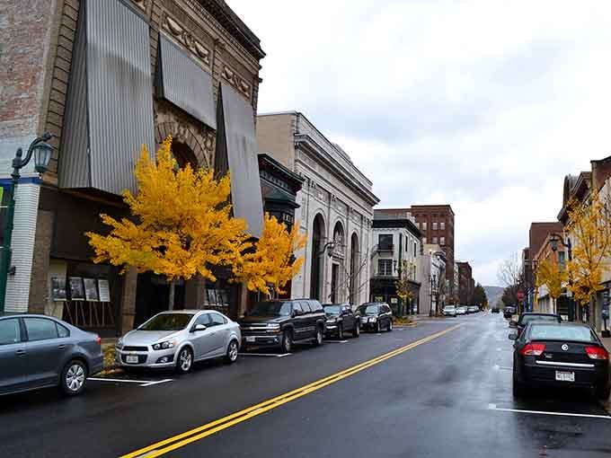 Golden autumn trees frame historic buildings on a street that looks like every great small-town movie scene.