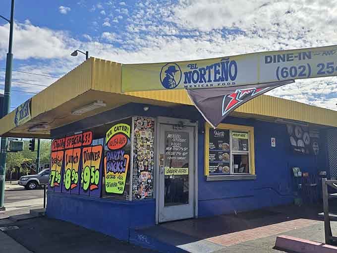 The vibrant hand-painted signs practically shout their daily specials to passing cars on this busy corner.