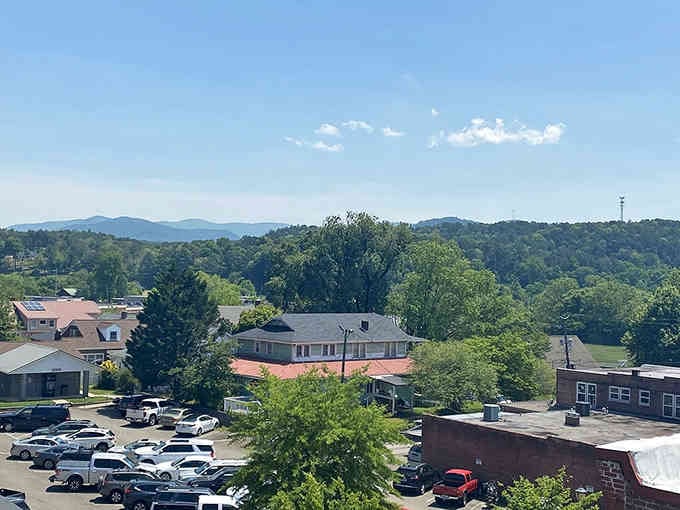 This view has it all with roofs and blue mountain peaks. It&rsquo;s a postcard waiting for a stamp and a story.