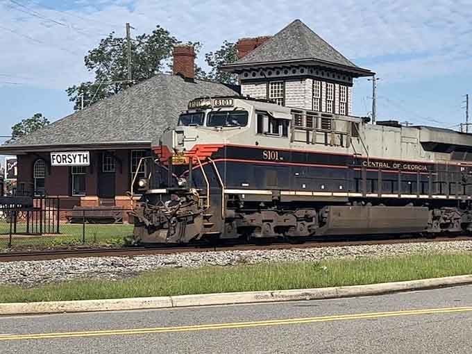 When a Central of Georgia locomotive rolls past that gorgeous tower, you're witnessing living history in motion.