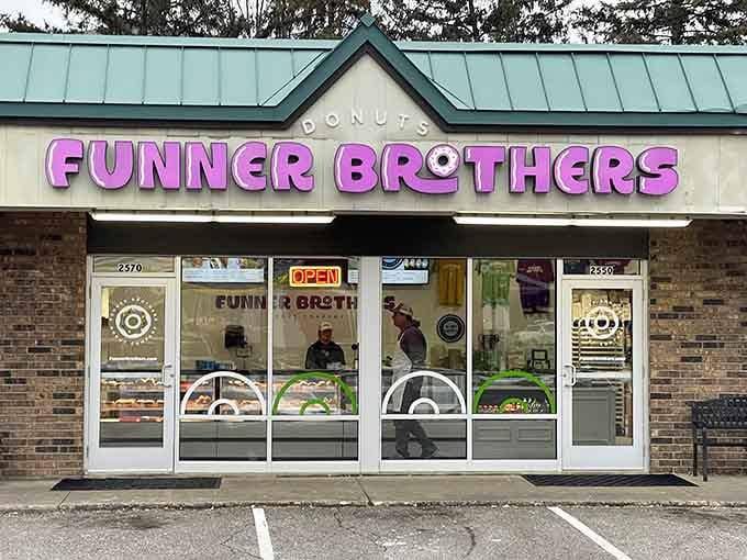 The hot pink lettering practically glows with personality, promising donuts that are anything but boring or ordinary.
