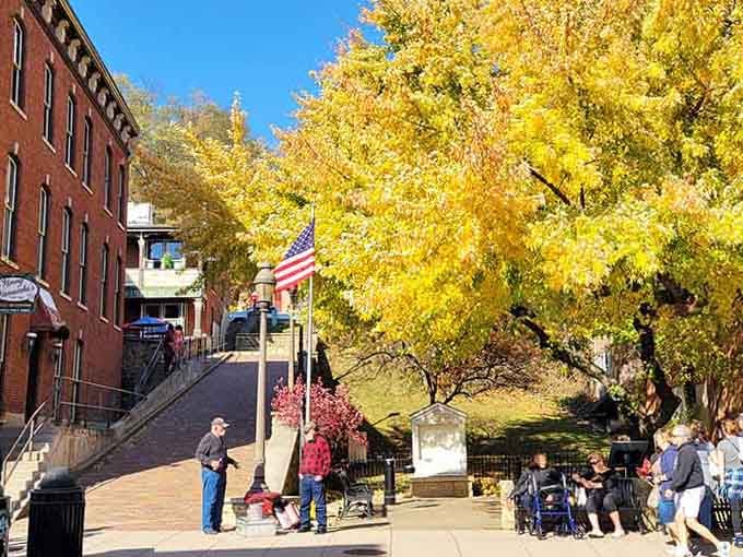 Golden autumn leaves frame brick buildings and friendly faces, creating scenes worthy of a Norman Rockwell painting.