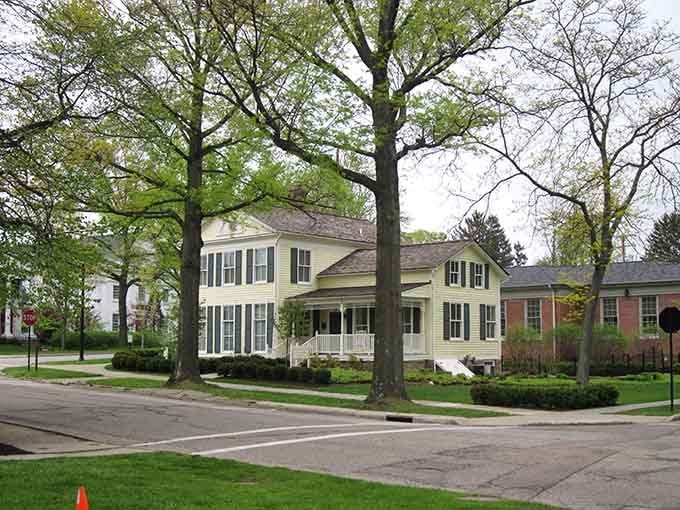 Classic white columns frame a historic home where generations have gathered under those magnificent shade trees for family celebrations.