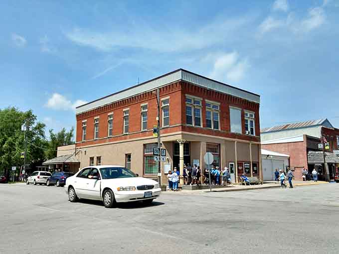 Red brick buildings line up like old friends catching up, their windows reflecting a town that time treated kindly.