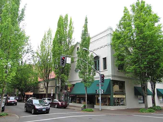 Green canopies shade the sidewalks where independent shops invite you to slow down and browse awhile.