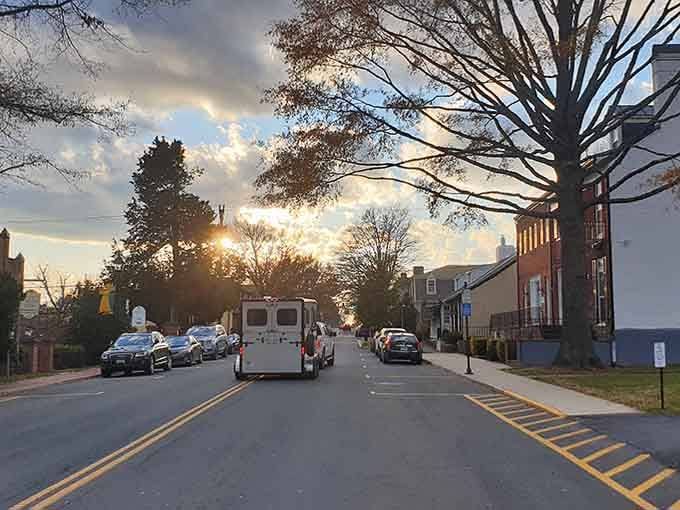 Golden hour transforms this quiet street into something magical, like a Norman Rockwell painting come to life.
