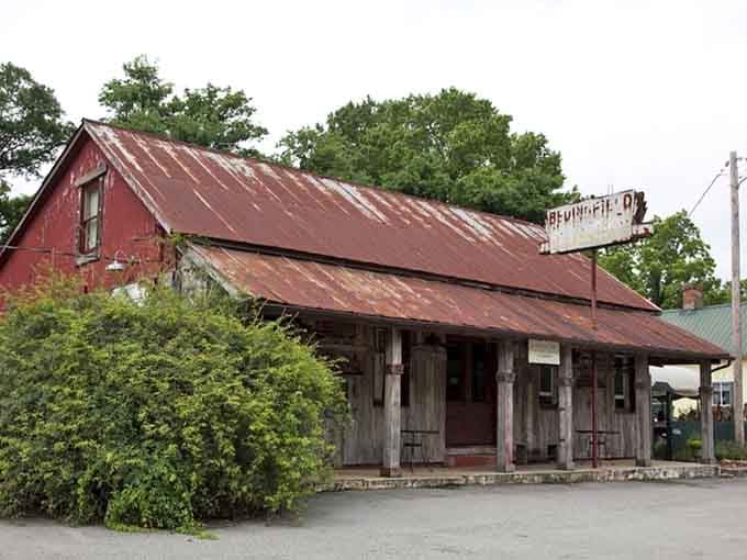 This weathered building wears its rusty tin roof like a badge of honor from decades past.
