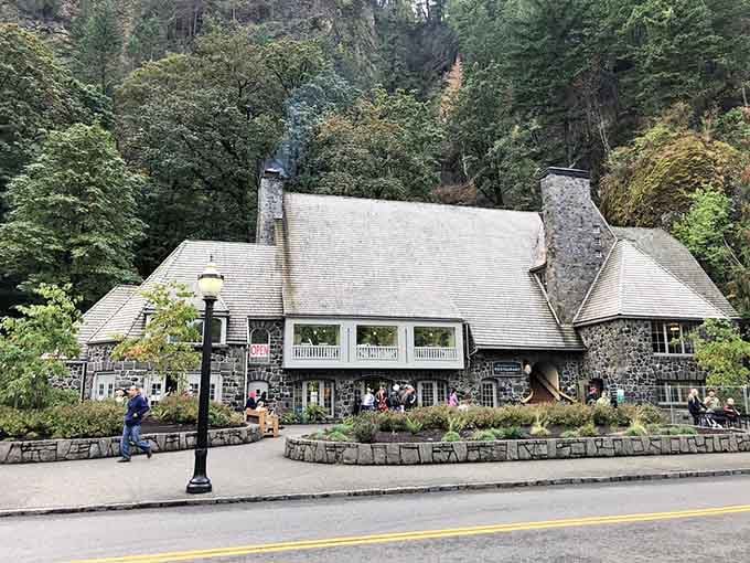 Nestled against towering cliffs and forest, this stone lodge offers front-row seats to one of nature's greatest shows.