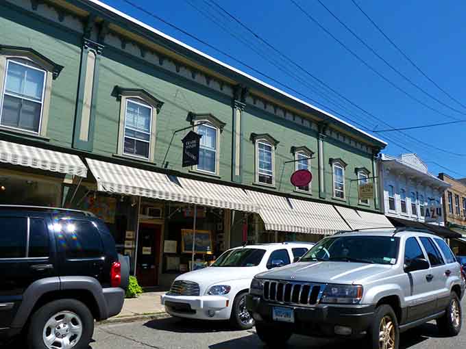 These colorful storefronts pop against a brilliant blue sky, proving old buildings can still steal the show.