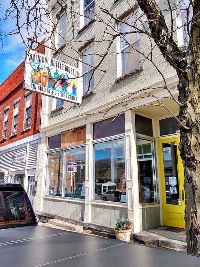 That cheerful yellow door welcomes bottle enthusiasts to discover the surprisingly colorful history hidden in antique glass containers.