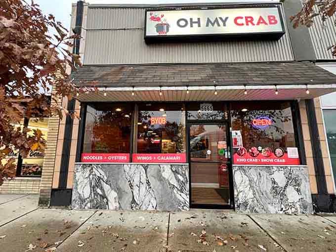 Oh My Crab's storefront practically shouts its mission: messy, spicy, utterly satisfying seafood boils await inside.