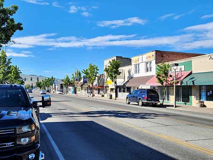 Colorful storefronts pop against blue skies, creating a cheerful streetscape that lifts spirits like a favorite song.