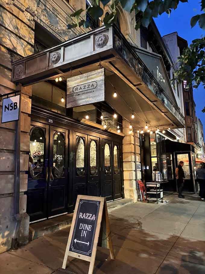 Those elegant arched windows and string lights create an atmosphere that's part neighborhood bistro, part Italian dream sequence.