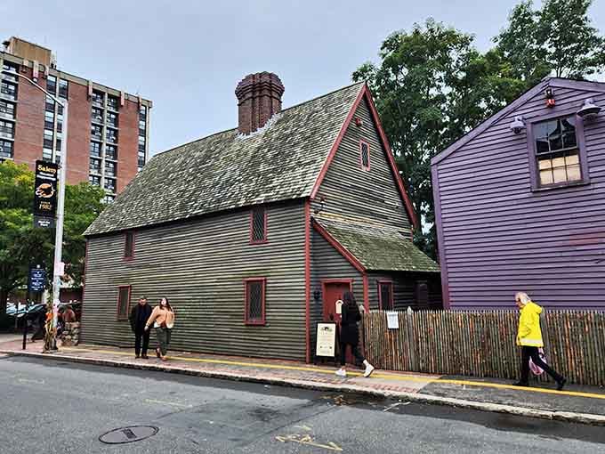 This dark wooden house has witnessed more history than most textbooks, standing proud amid the modern city that grew around it.