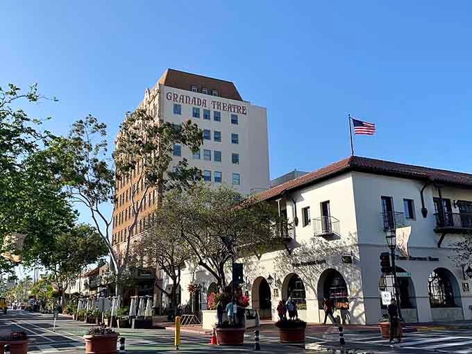 The Granada Theatre towers above Spanish Colonial architecture, creating a downtown scene that feels both elegant and welcoming.