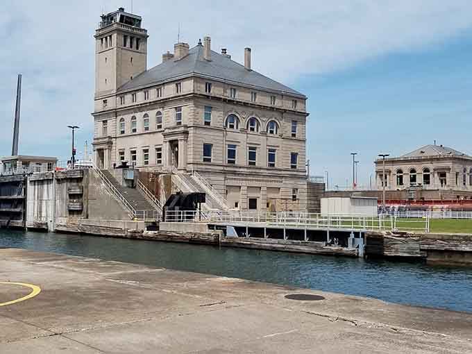 That impressive stone tower stands watch over the locks where massive freighters navigate between two Great Lakes.