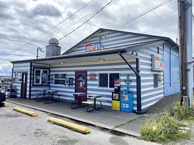 This weathered waterfront cafe with its striped siding looks like it stepped right out of a coastal postcard.