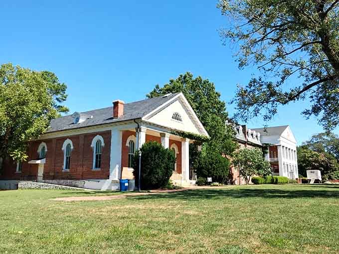 Colonial-era buildings rest peacefully on manicured lawns at St. Mary's City, Maryland's original capital settlement.