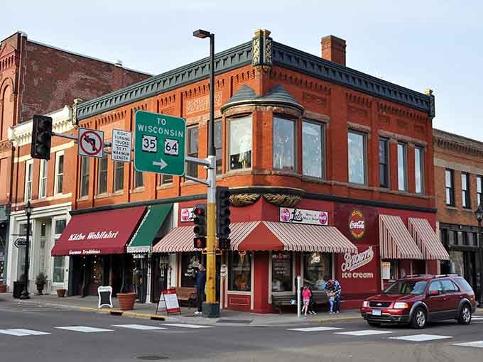 That corner storefront with the striped awning practically whispers "come browse" in the most welcoming Main Street voice imaginable.