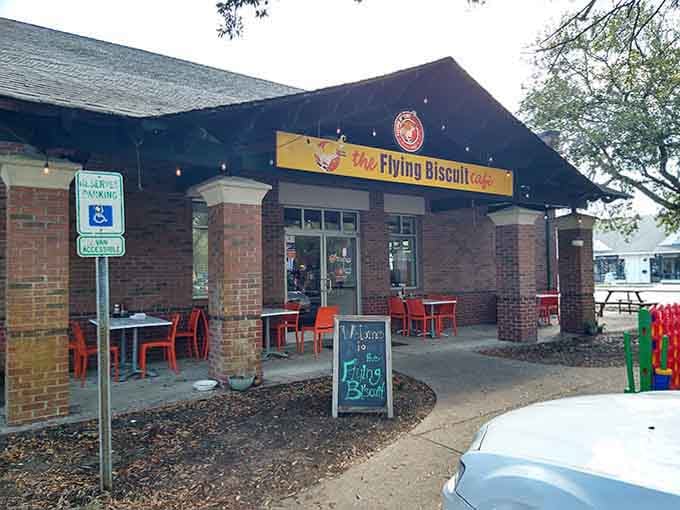 The cheerful yellow sign and bright red outdoor seating make this spot impossible to miss on your morning drive.