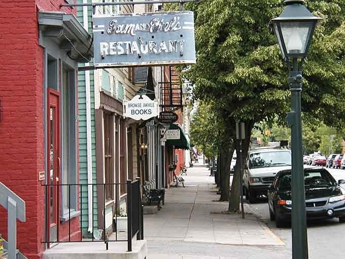 Vintage restaurant signs and bookshops line sidewalks where neighbors still stop to chat about the weather and life.