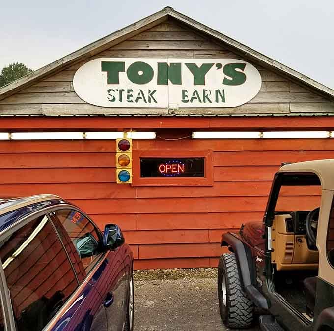 A barn-shaped building painted bright orange means serious business when it comes to serving perfect steaks.