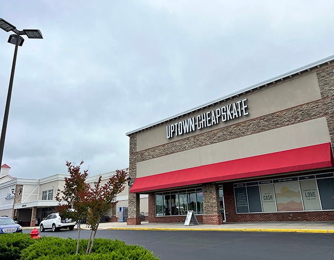 Modern stone accents and red trim elevate this thrift experience from ordinary to surprisingly upscale shopping destination.
