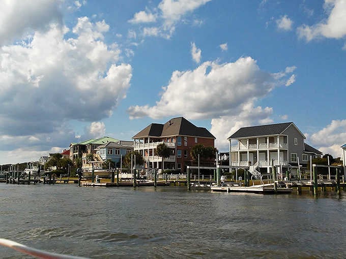 Waterfront homes stand ready to welcome visitors seeking fresh-caught seafood and that salty coastal breeze with every bite.