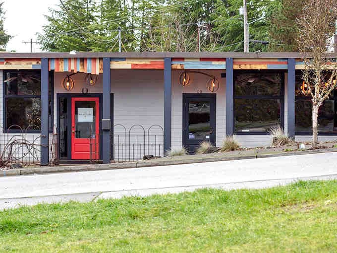 That welcoming red door beckons like Dorothy's ruby slippers, promising a journey to somewhere magical and meaty inside.