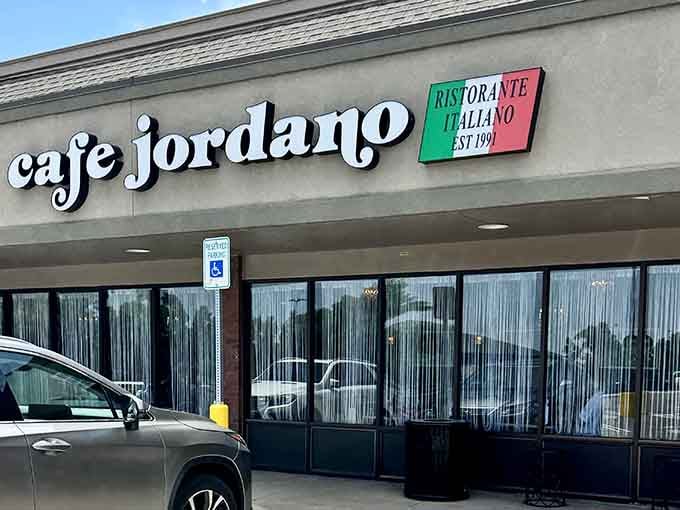 Behind those curtained windows, homemade sauces simmer like they would in any proper Italian kitchen.