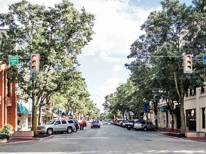 Mature trees shade streets where people still wave from their porches, creating that Norman Rockwell feeling we all secretly crave.