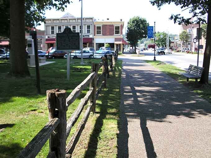 Wooden fences and historical markers create a peaceful path where past and present shake hands every day.