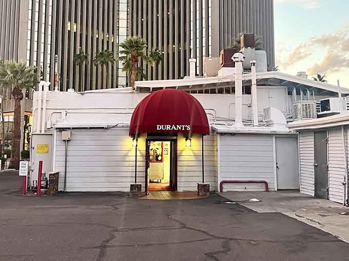 The glowing doorway beckons like a portal to old-school steakhouse heaven in downtown Phoenix.