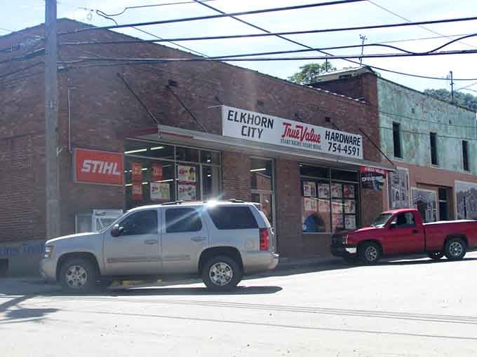 The hardware store stands ready with everything you need, proving small-town shopping still works beautifully here.